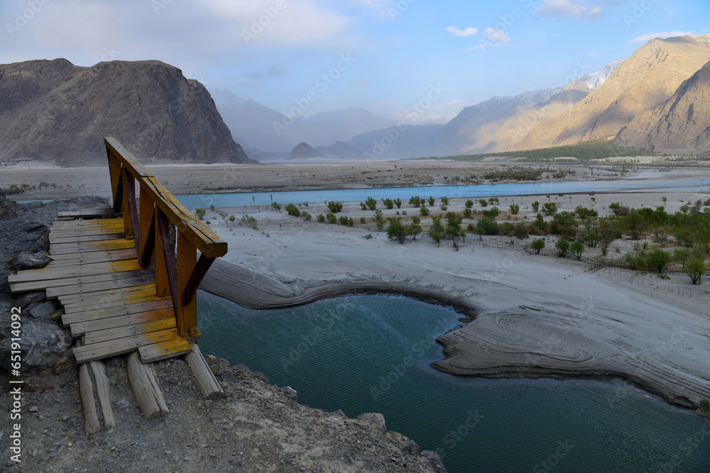 Wooden bridge on the edge of a mountain, located at the bank of Indus ...
