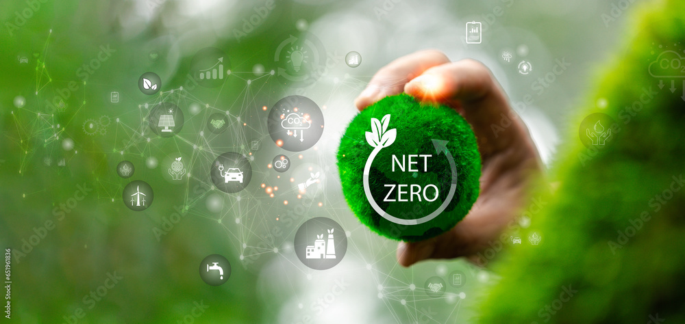Net zero icon and carbon neutral concept in the hand for net zero greenhouse gas emissions ...