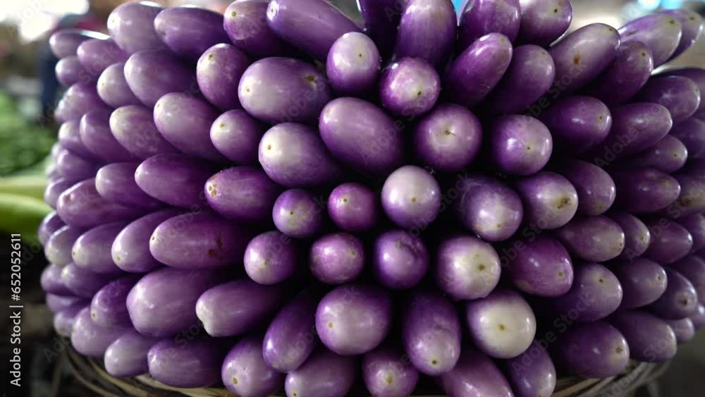 Fresh brinjal at market. Brinjal, also known as eggplant or aubergine ...