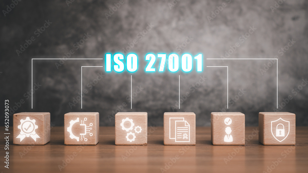 Iso 27001 concept, Wooden block on desk with iso 27001 icon on virtual ...