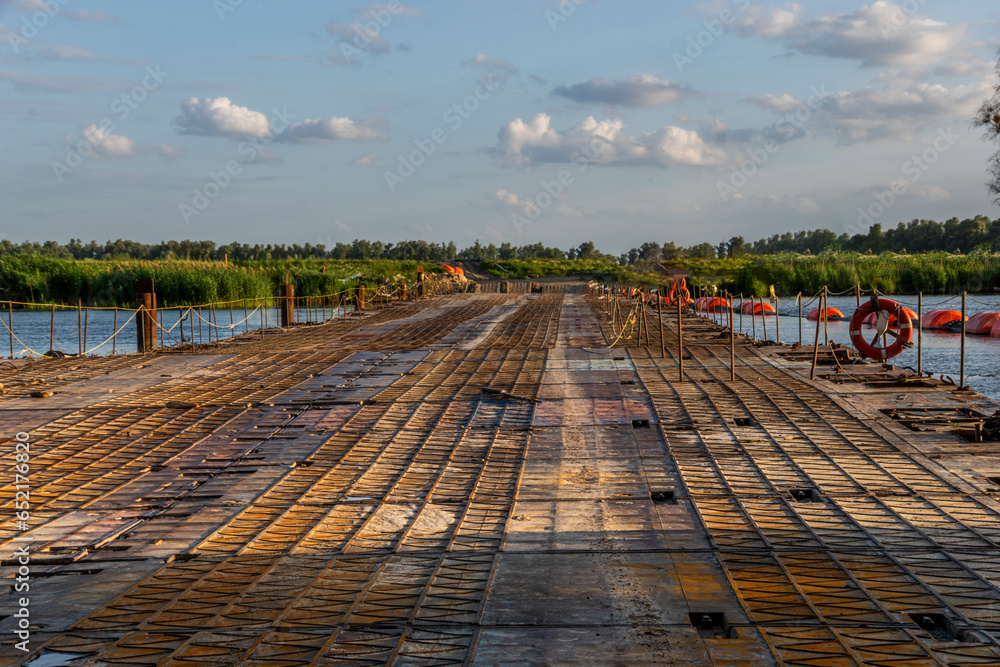 Military pontoon bridge used for crossing combat vehicles over a large ...