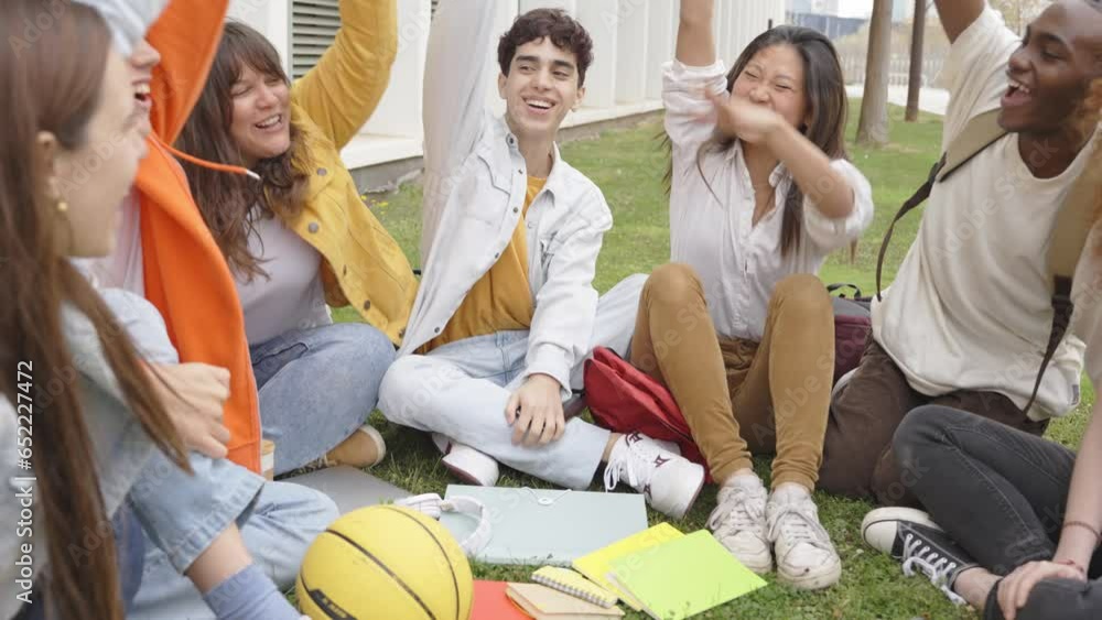 Multicultural university students stacking hands together in college ...