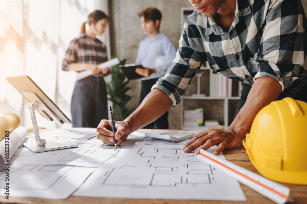 Engineer Teamwork Meeting, Drawing working on blueprint meeting for ...