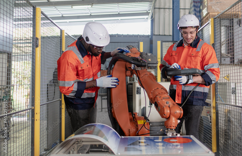Foto de Industrial engineer inspecting mechanic part of robot structure ...
