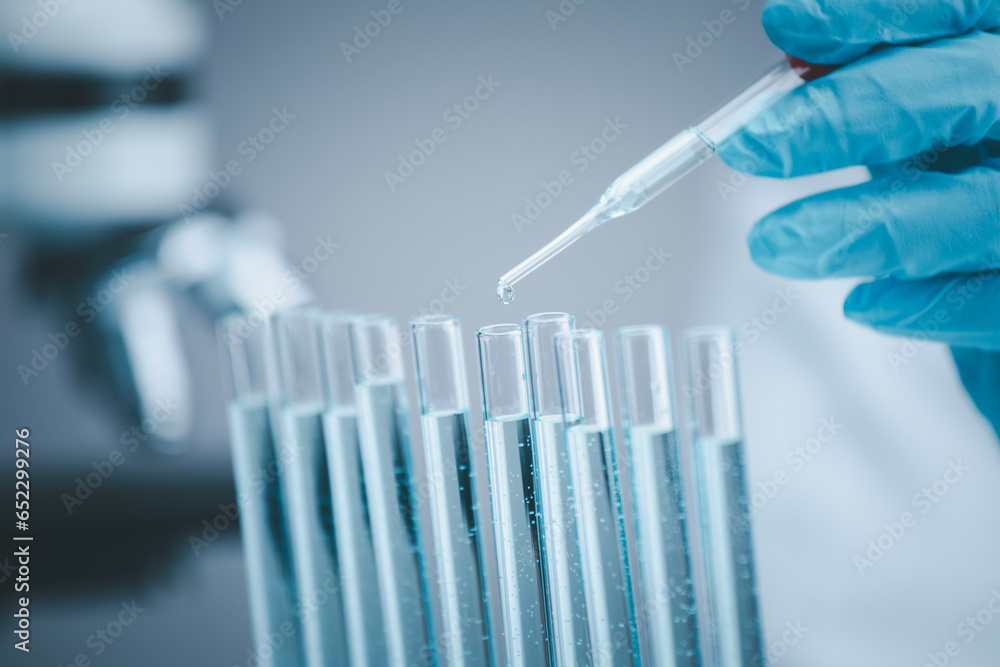 Foto de Microscope with lab glassware, nanotechnology conducting ...