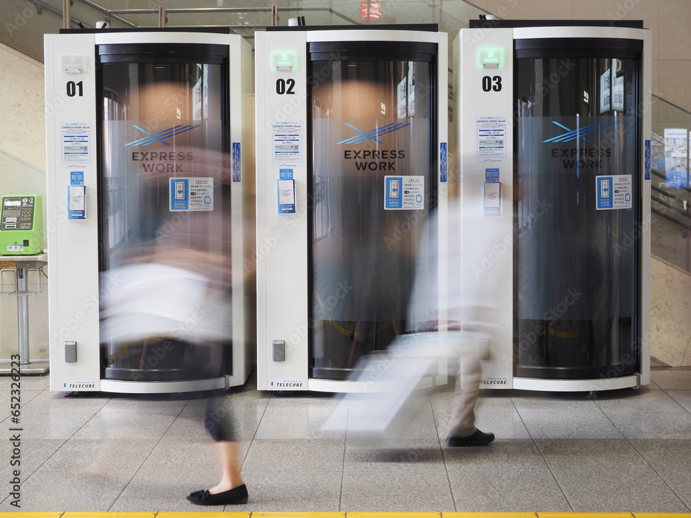 TOKYO, JAPAN - September 24, 2023: A row of Express Work booths inside ...