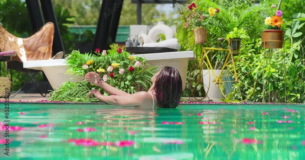 Happy Indian Asian young adult wet woman lady pool enjoy fun joy summer ...