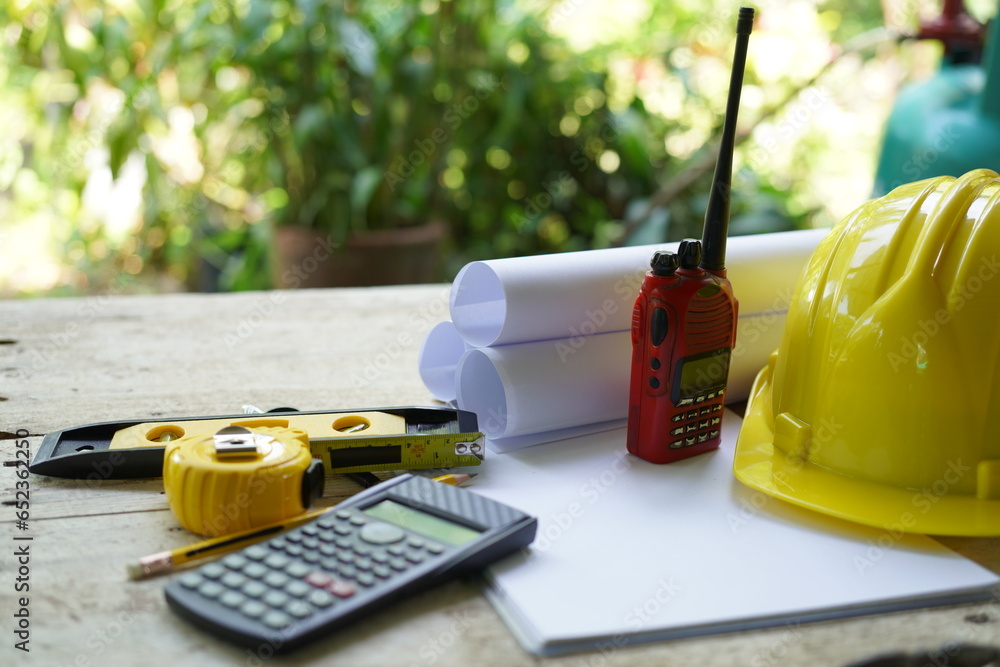 Set of professional construction tools and safety helmet on a work ...