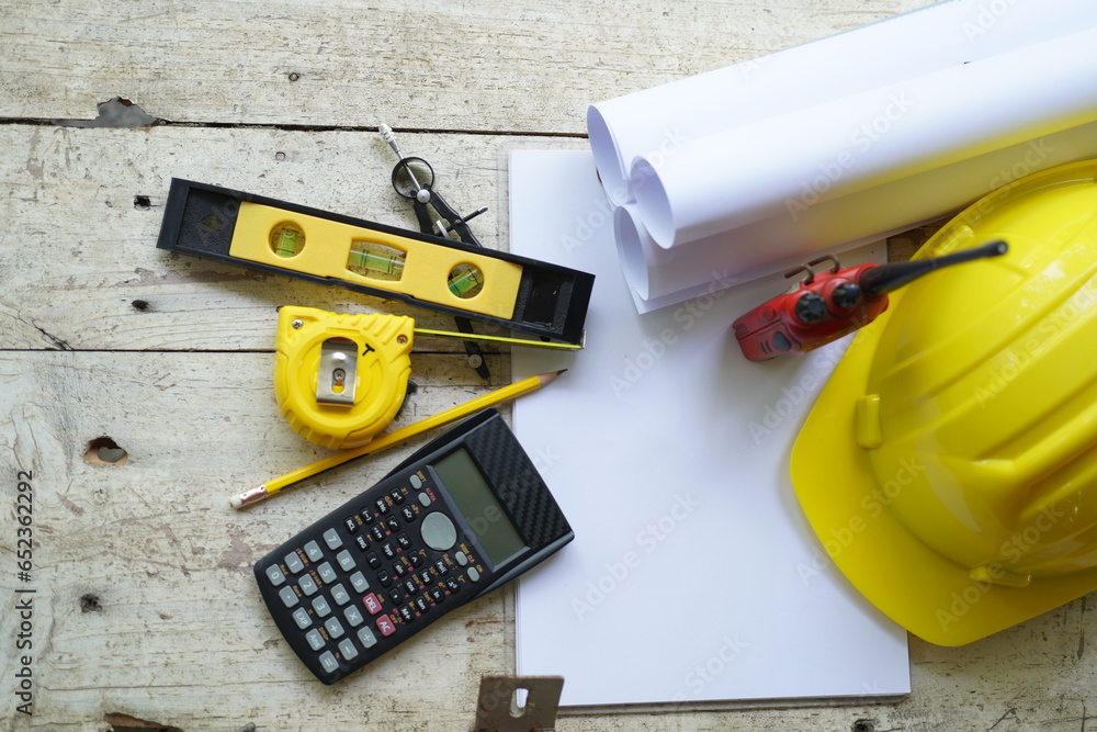 Set of professional construction tools and safety helmet on a work ...