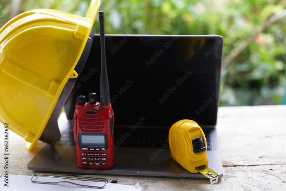 Set of professional construction tools and safety helmet on a work ...