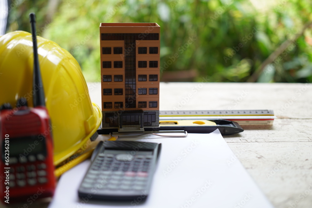 Set of professional construction tools and safety helmet on a work ...