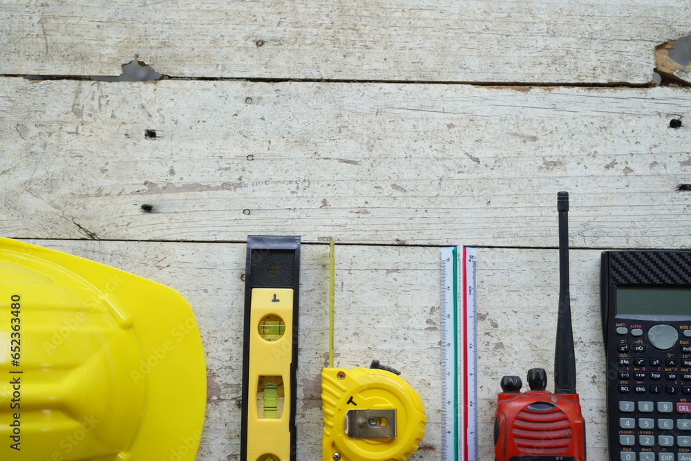 Set of professional construction tools and safety helmet on a work ...