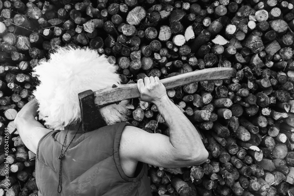 Woodcutter or lumberjack with the axe with wooden handle. The hatchet ...