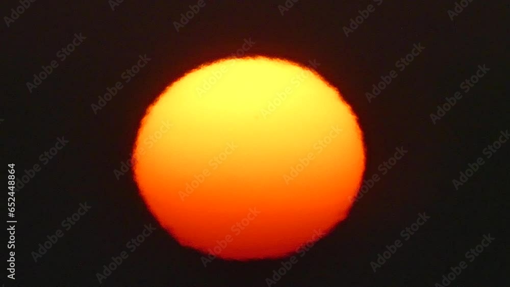 Dark sky with red and yellow solar disk with Atmospheric refraction ...