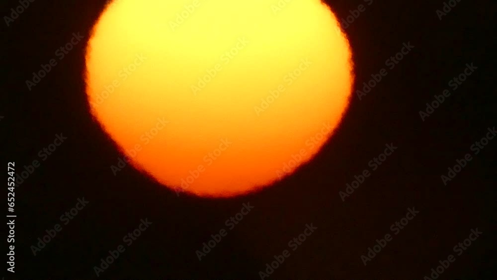 Dark sky with red and yellow solar disk with Atmospheric refraction ...