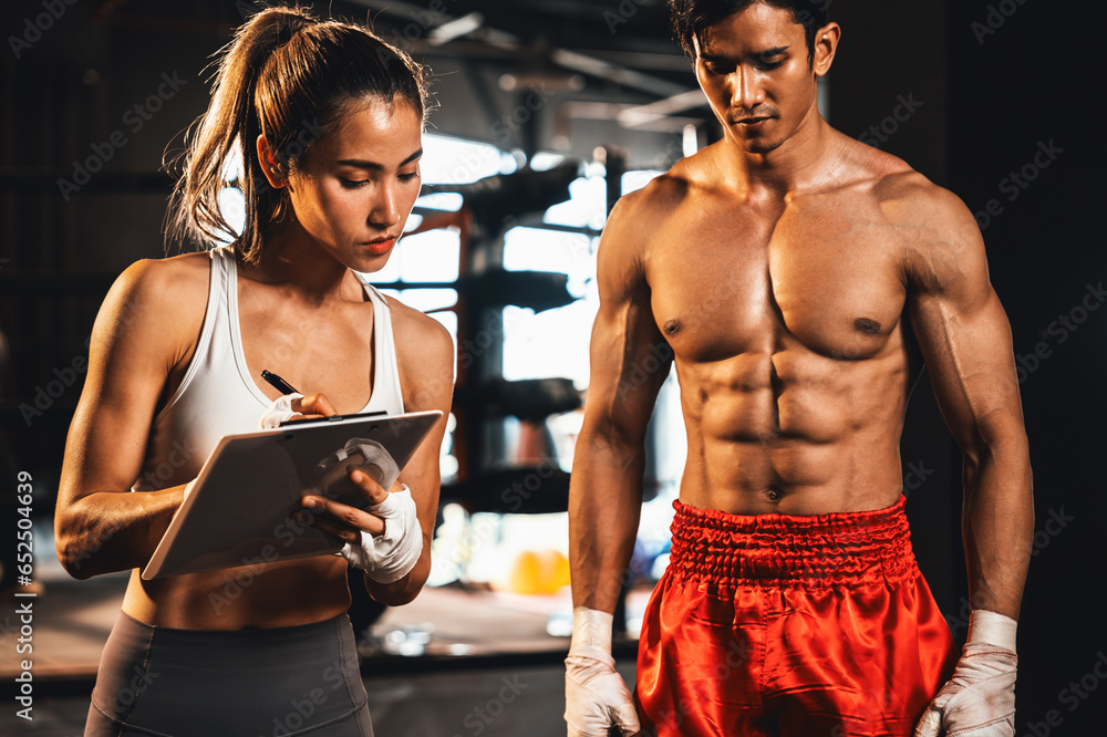 Muay Thai boxer step on weight scale for boxing class designation by ...