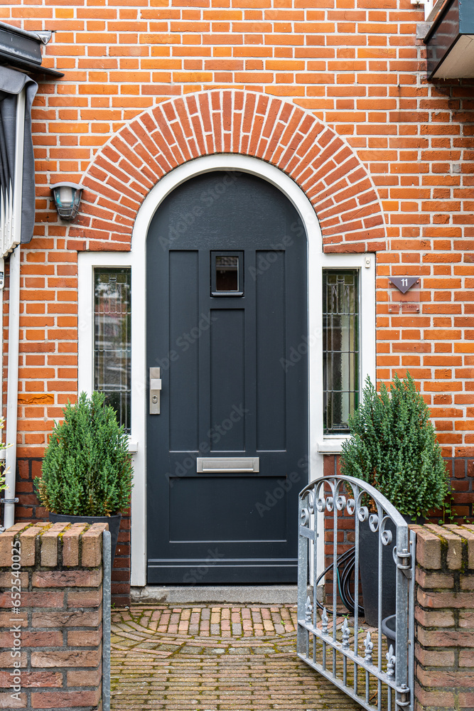 Wooden front door of a home. Front view of a wooden front door on a ...