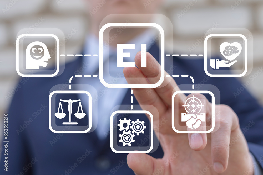 Man using virtual touch interface presses acronym: EI. Emotional and ...