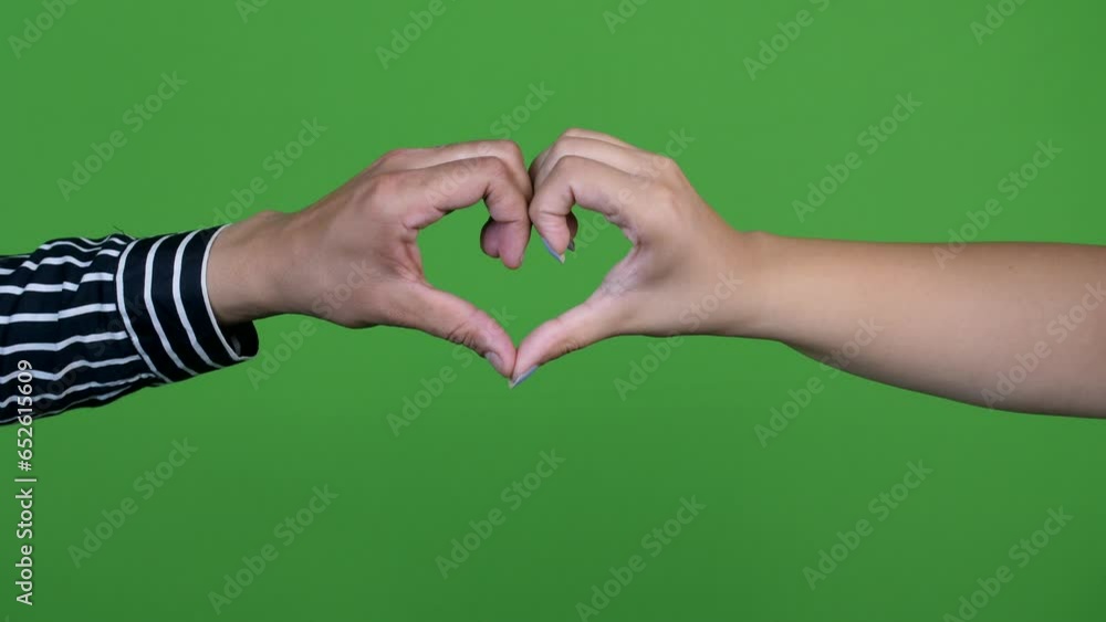 Boy and girl making a heart shape using hands - green screen love and ...