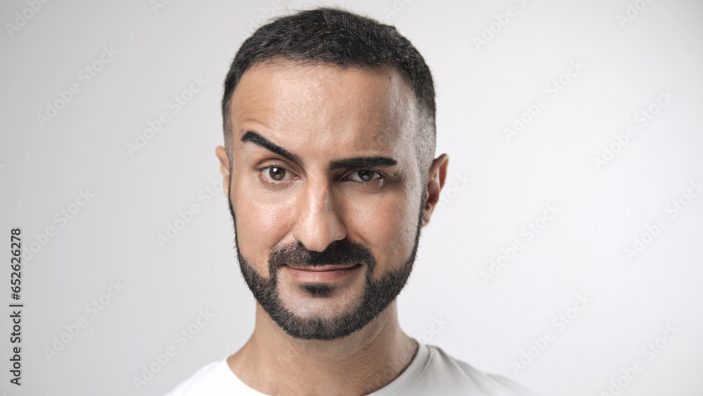Handsome person look at camera close up. Young adult man face portrait ...