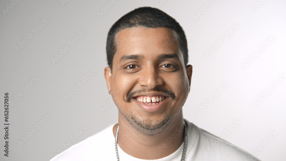 Handsome person look at camera close up. Young adult man face portrait ...