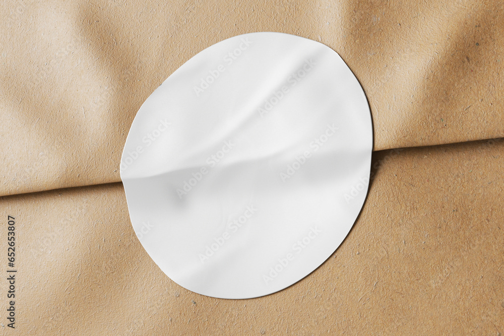 peeled and crumpled round circular adhesive sticker label tag glued on ...