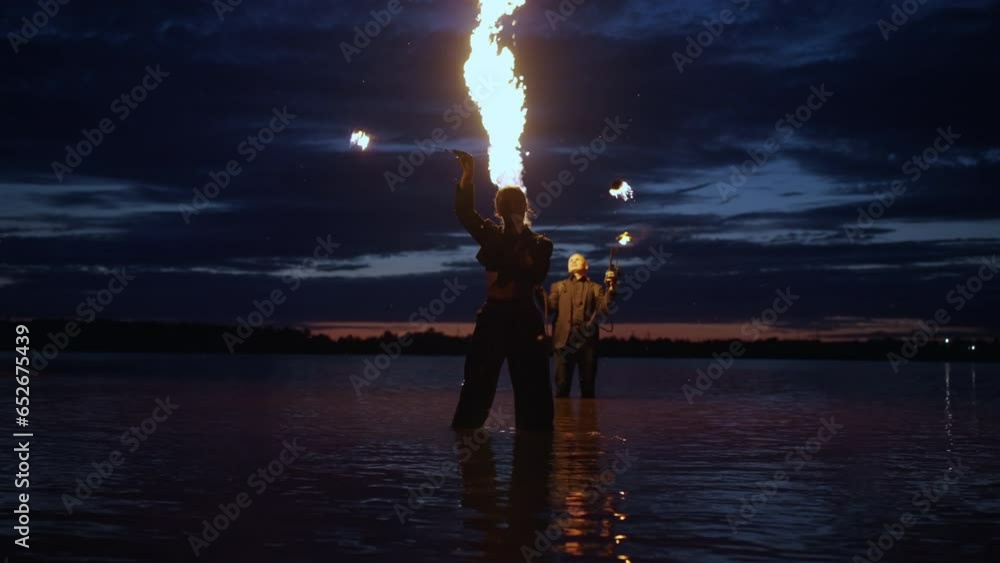 Professional Stuntwoman And Stunt Man Performing Tricks With Fire ...