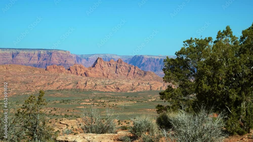 Tilt up extreme wide landscape shot revealing a dry desert landscape ...