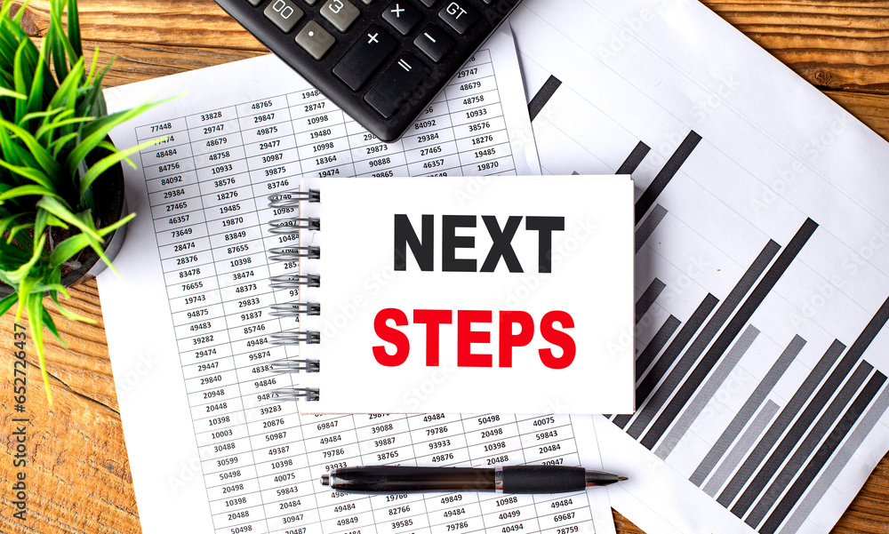 NEXT STEPS text on a notebook with chart and calculator Stock Photo ...