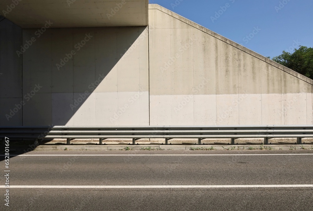 Guardrail in protection of sidewalk and concrete wall of an underpass ...
