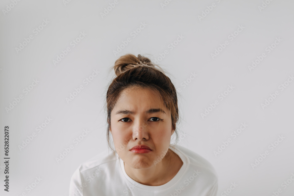 Asian woman bun funny sad face, sulking and frowning disappointed look ...