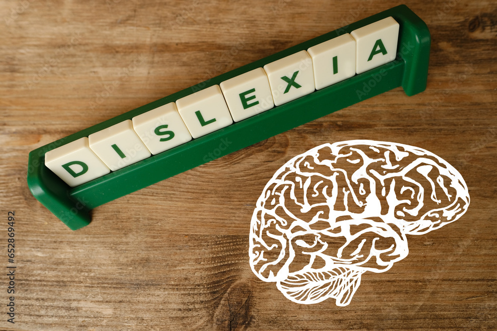 human brain, alphabet blocks, DYSLEXIA word on wooden background ...