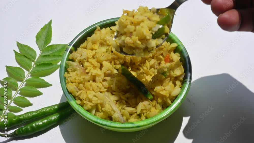 Vegetable Poha in India. It is made by mixing vegetables, poha and ...
