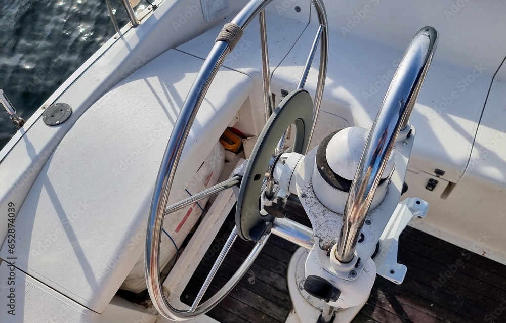 Binnacle on yacht with wheel and controls for steering boat on course ...