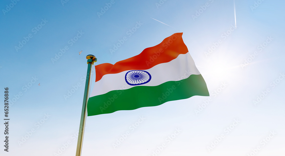 Flag of India flag waving in the wind, sky and sun background. India ...