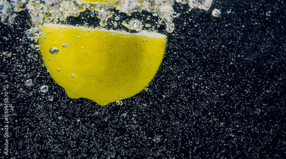 Underwater of freshly squeezed sweetened lemonade which raw lemons ...