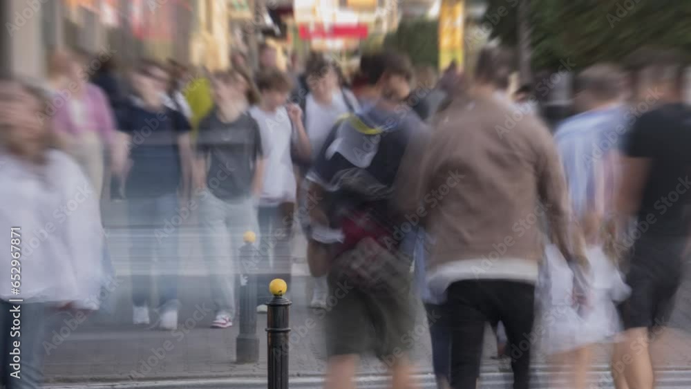 Time-lapse unrecognizable people crowd crossing city street, busy ...