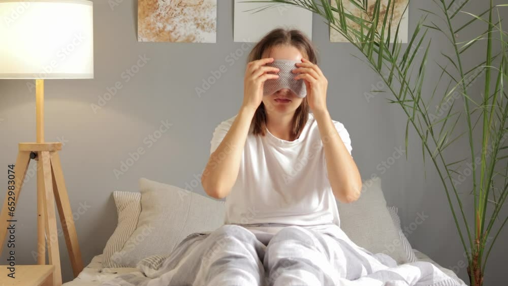 Sad sleepy young woman waking up in uncomfortable bed feeling ache in ...