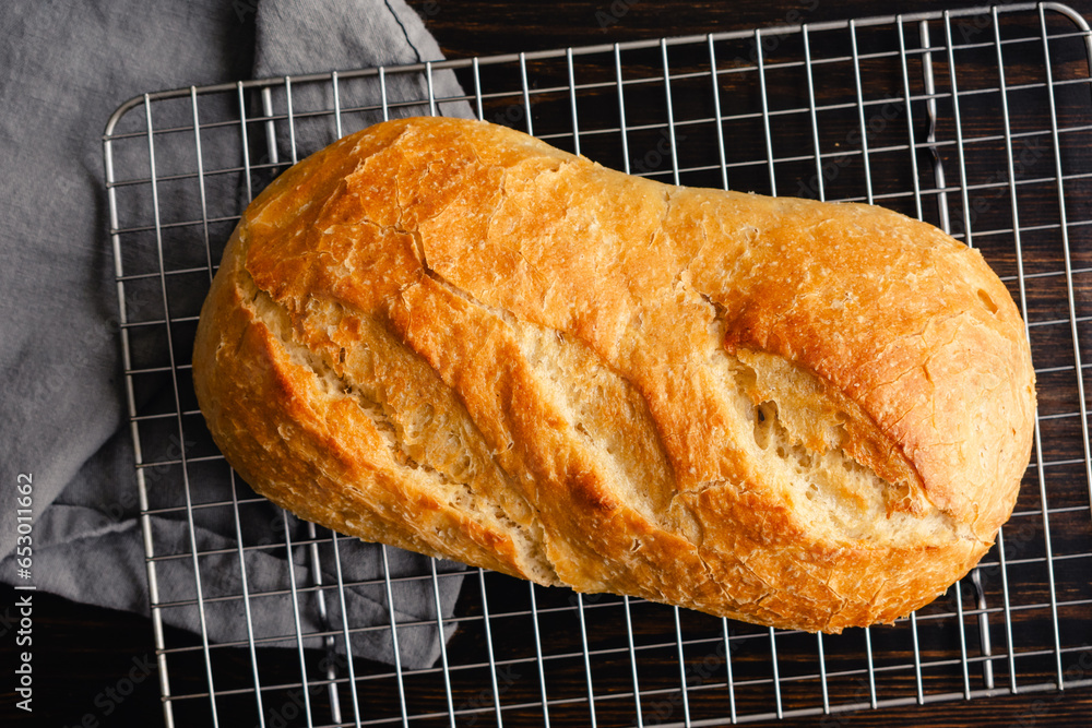 Poster Loaf of Freshly Baked Sourdough Bread: An unsliced loaf of ...