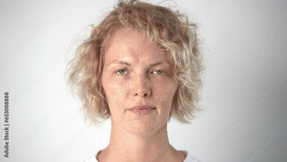 Beautiful person look at camera close up. Young adult woman face ...