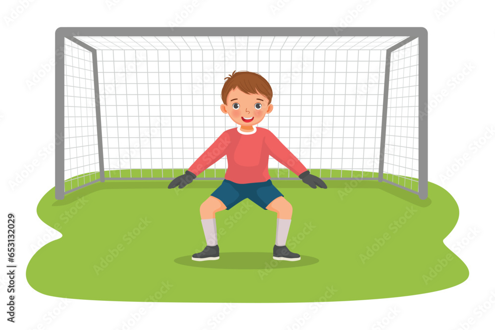 Cute little boy playing soccer ball as a goalkeeper standing in pose at ...