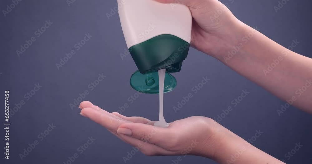 Shower gel in white bottle poured into woman palm. Concept of skin ...