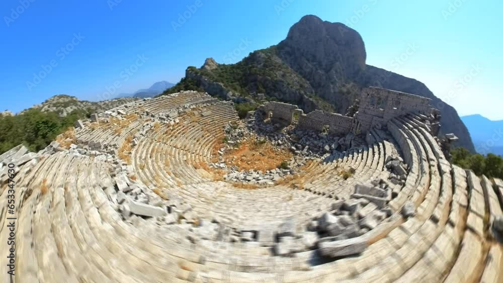 Aerial view in HYPER-LAPSE of the ancient theater in Mount Gulluk ...