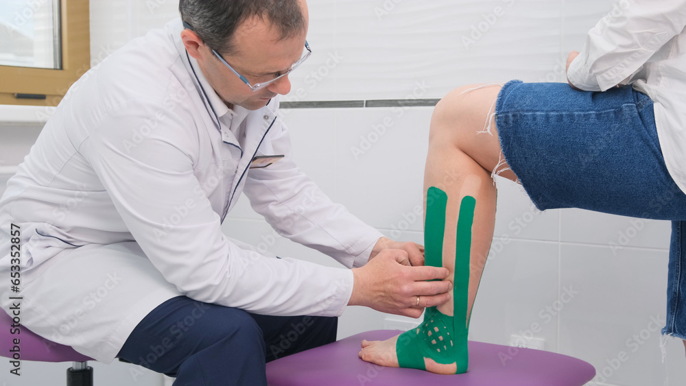 The doctor examines the patient's diseased ankle joint for fractures ...