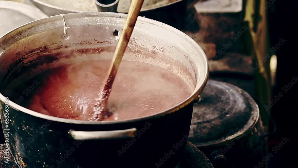 Ambient motion of stirring sikwate or Filipino hot chocolate in an old ...