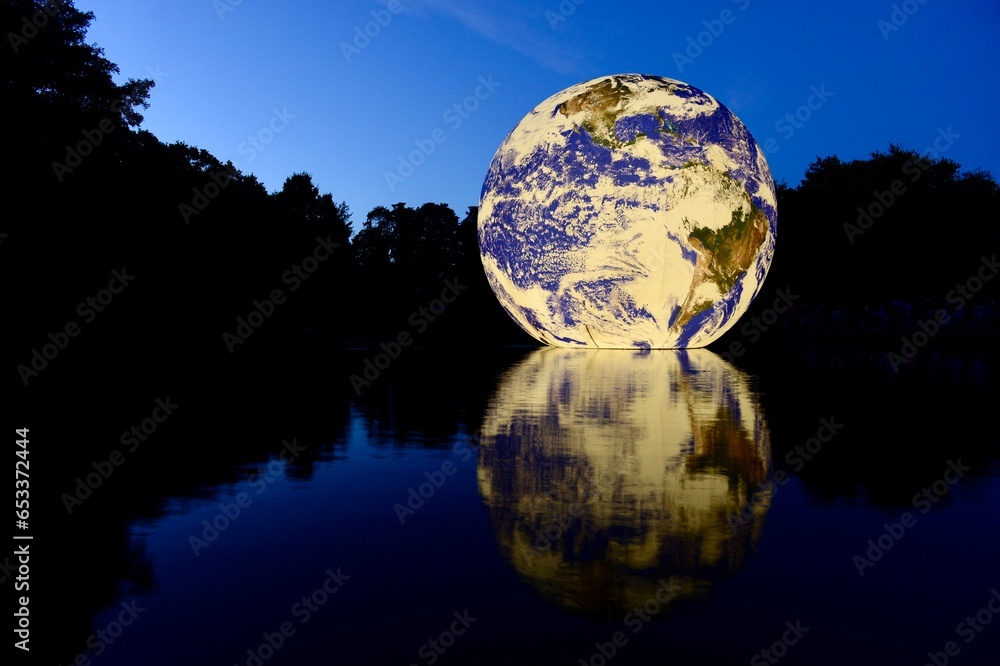 Floating Earth, Jersey, U.K. Queens valley reservoir. A floating 10 ...