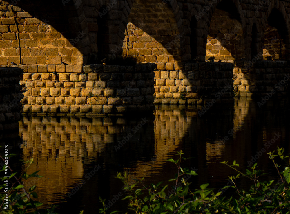 Three rock brick arches of the Roman bridge of Mérida over the Tormes ...