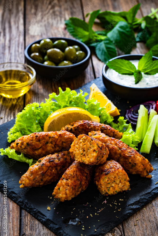 Kibbeh - Arabic style seared meatballs mixed with bulgur groats and ...