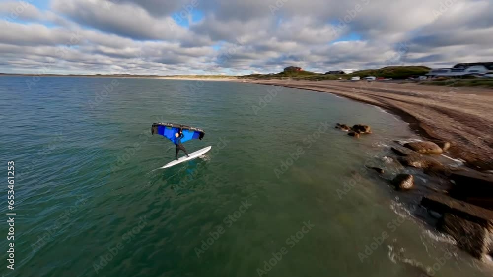 Modern water sport. Hydrofoil ride on the ocean using the wing and the ...