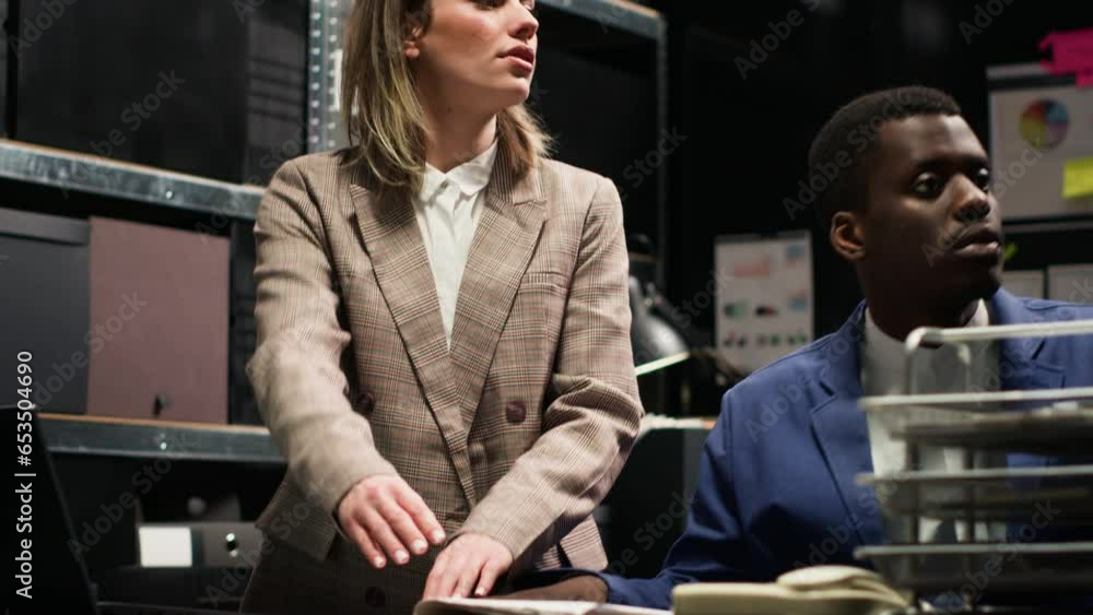 Diverse team of investigators conduct confidential investigation ...